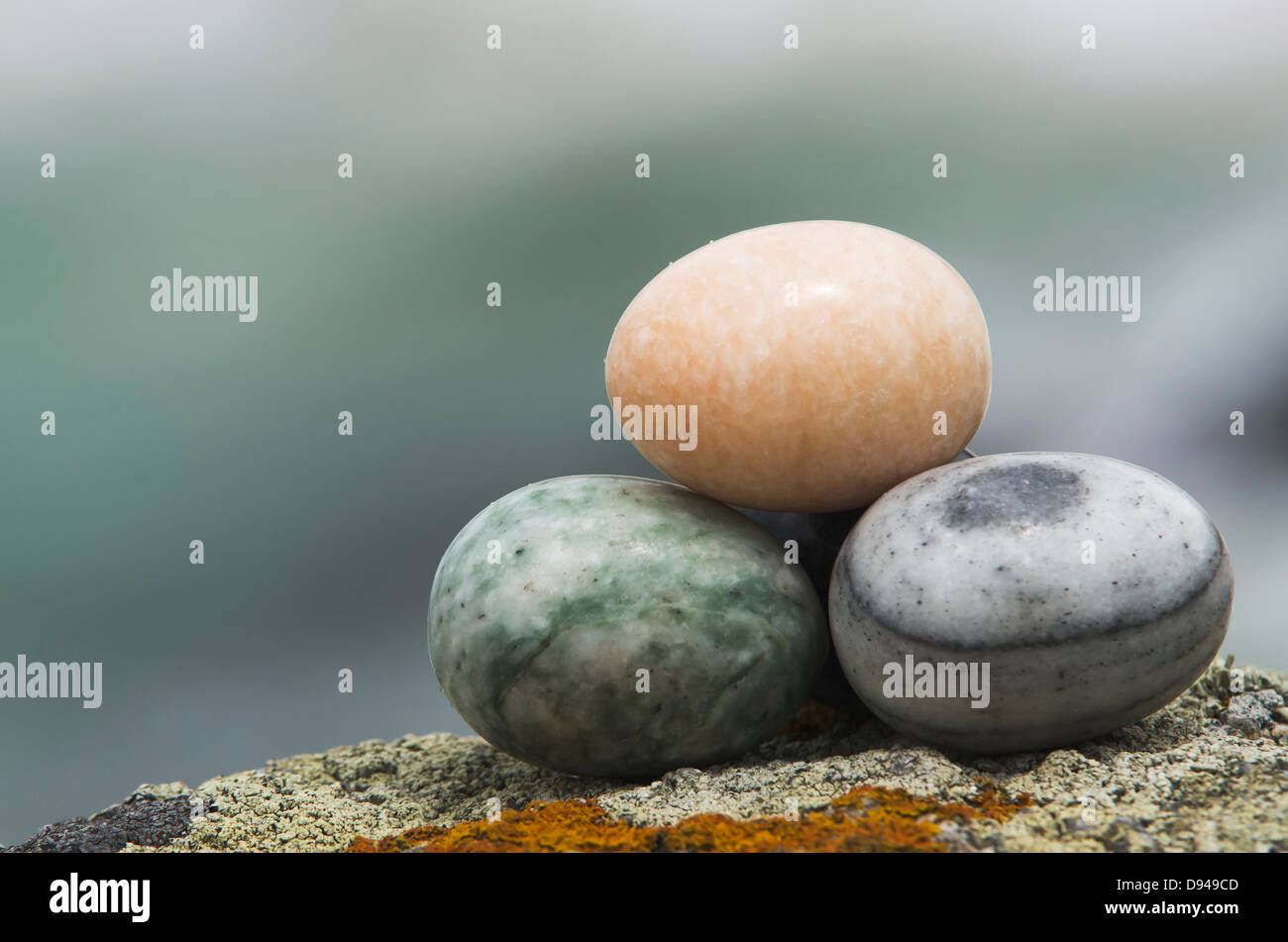 polished stones of different colors at the beach Stock Photo - Alamy