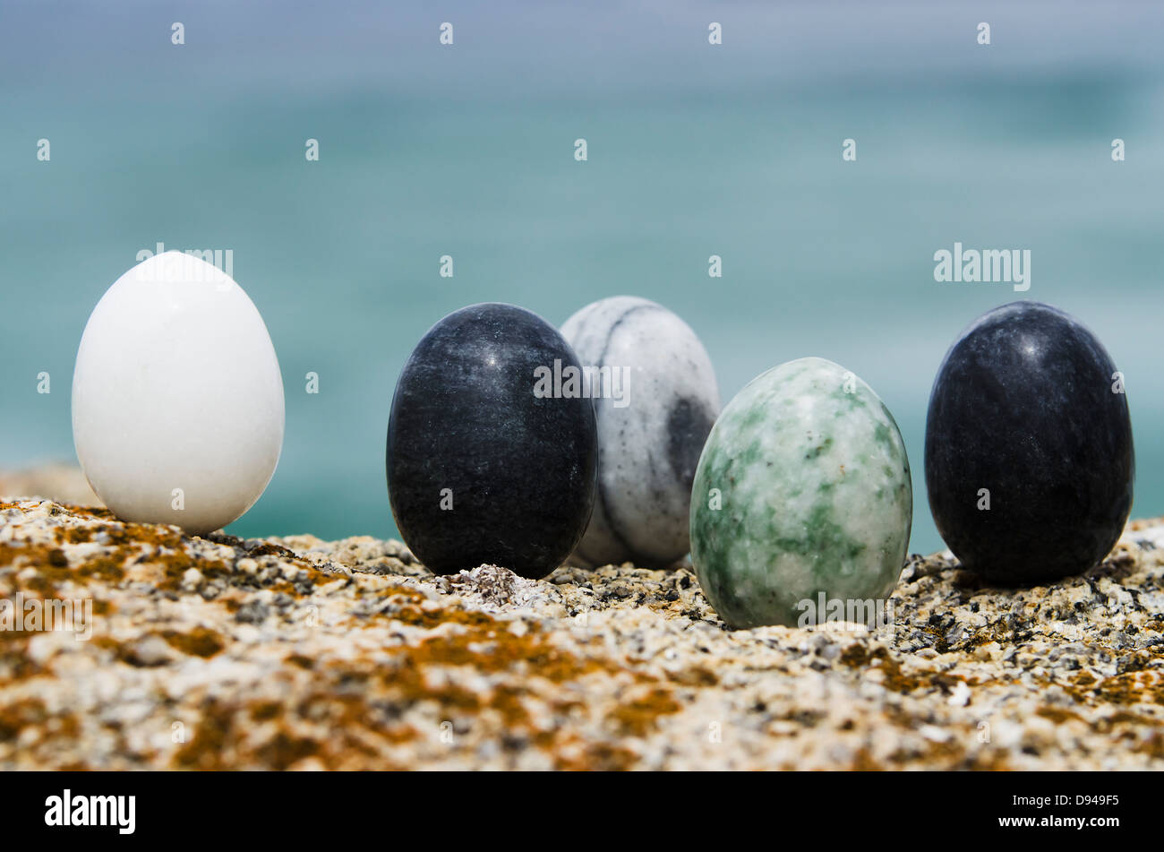 polished stones of different colors at the beach Stock Photo - Alamy
