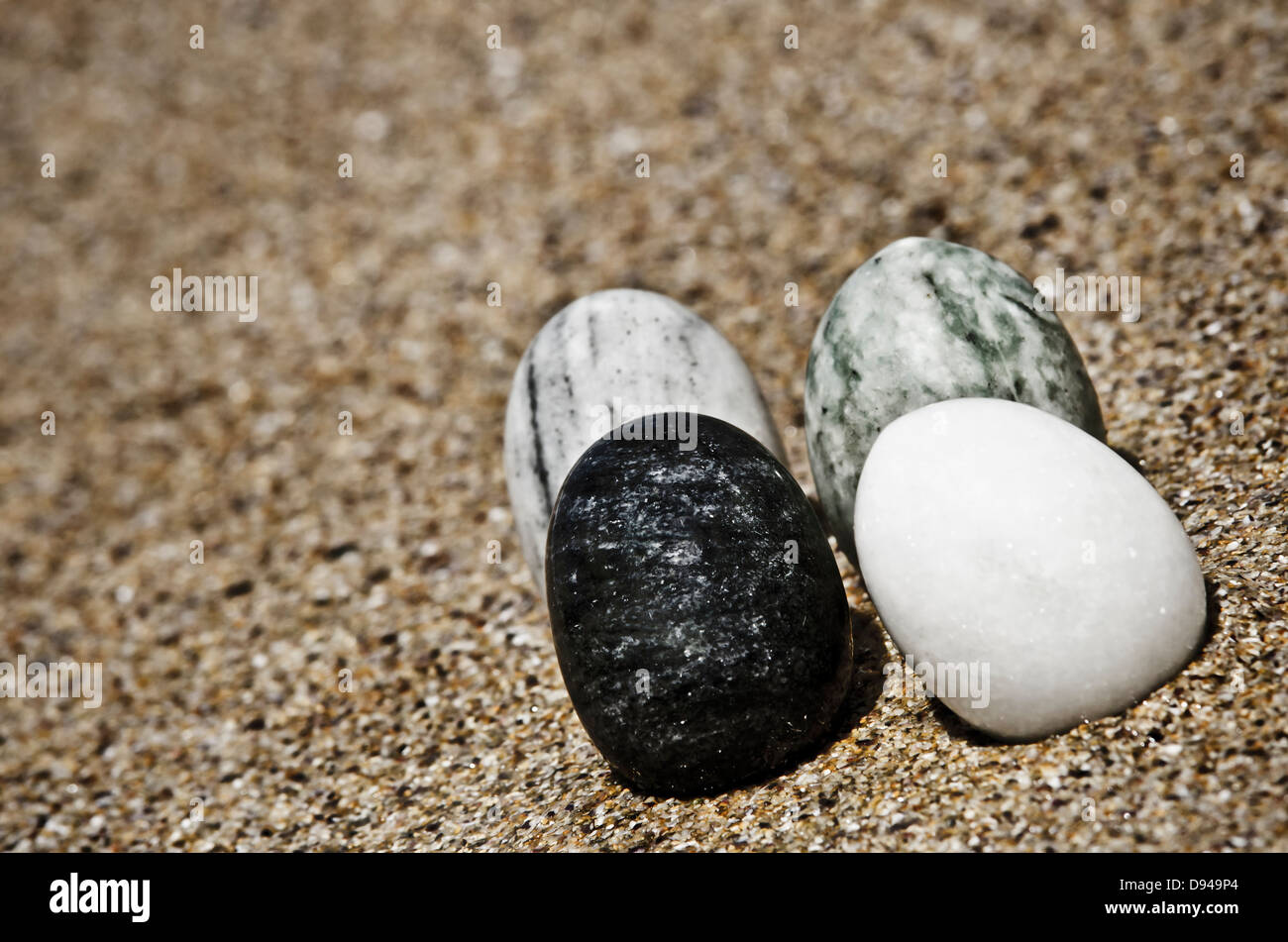 polished stones of different colors at the beach Stock Photo - Alamy