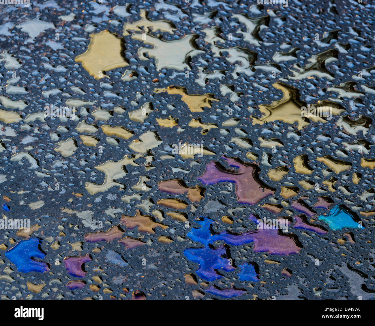 Colorful liquid in puddle, close-up Stock Photo - Alamy