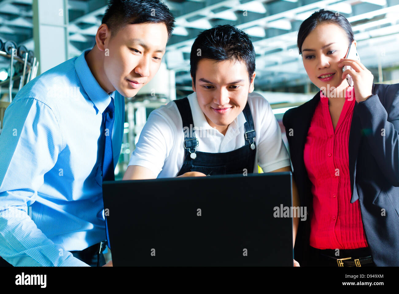 Worker or production manager and customer service, look on a laptop in ...