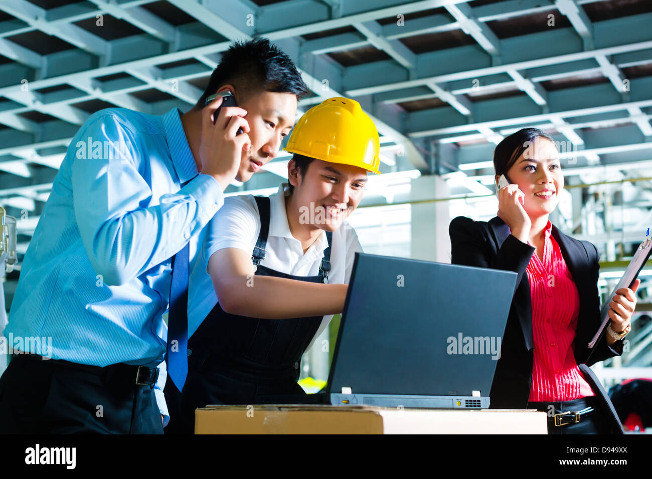 Worker or production manager and customer service, look on a laptop in ...