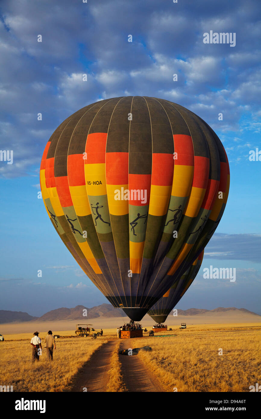 Launching hot air balloons in early light, Namib Desert, near Sesriem ...