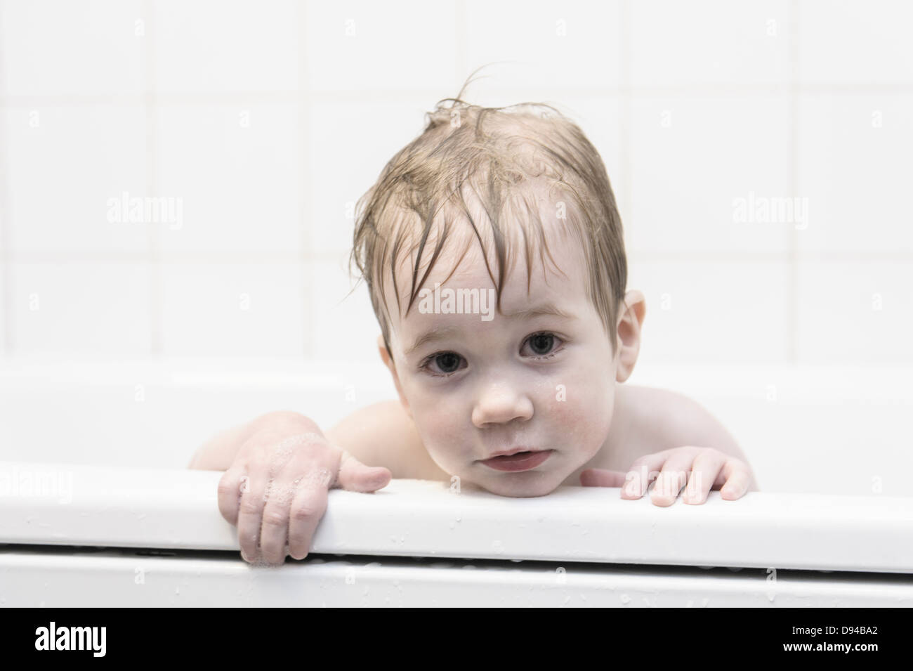 Portrait of boy in bath Stock Photo - Alamy