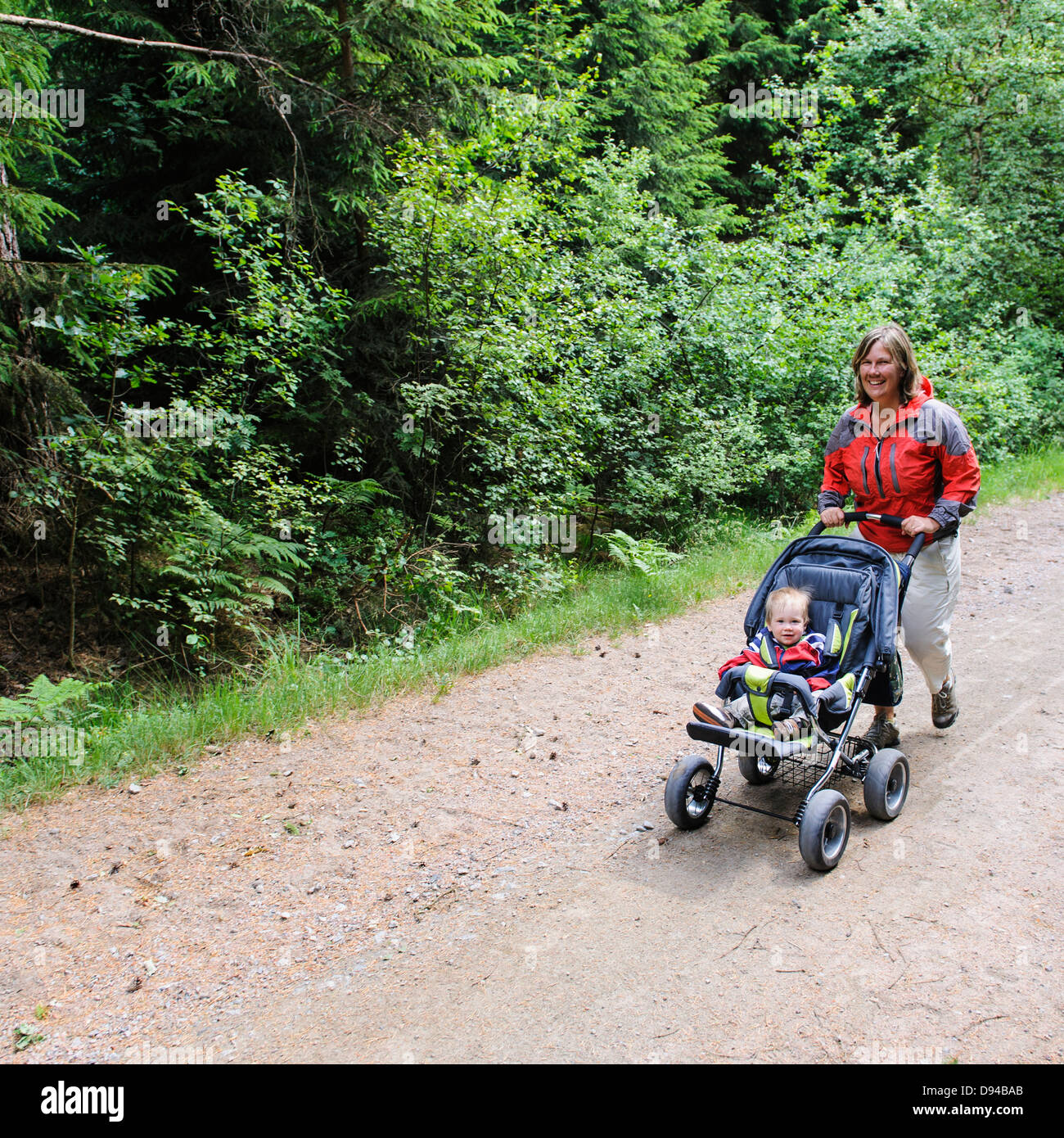 Mother and baby pram park walking hi-res stock photography and images ...