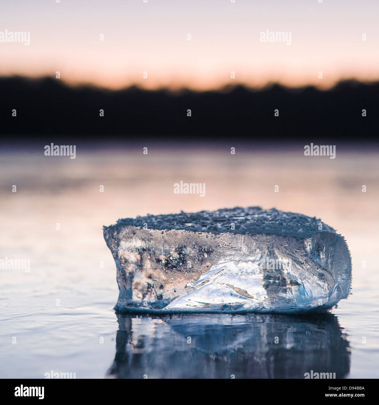 Chunk of ice on frozen lake Stock Photo - Alamy