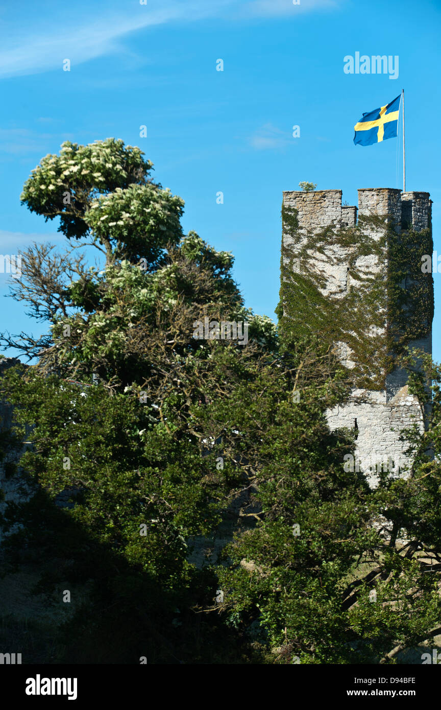 Medieval tower with swedish flag Stock Photo - Alamy