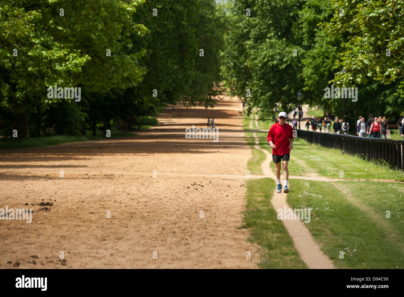 Man in red running. Picture by Julie Edwards Stock Photo - Alamy