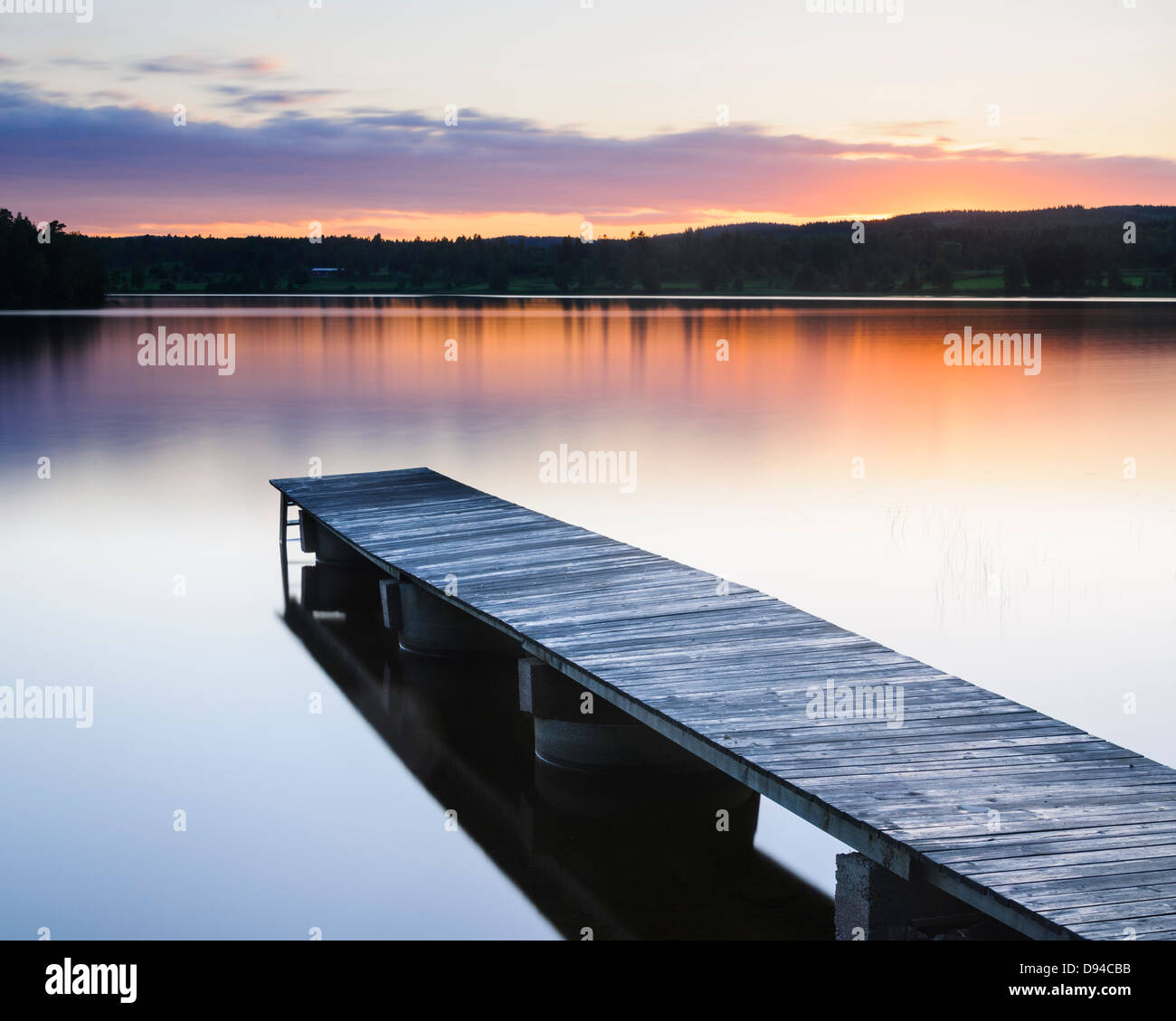 Jetty at sunset Stock Photo - Alamy