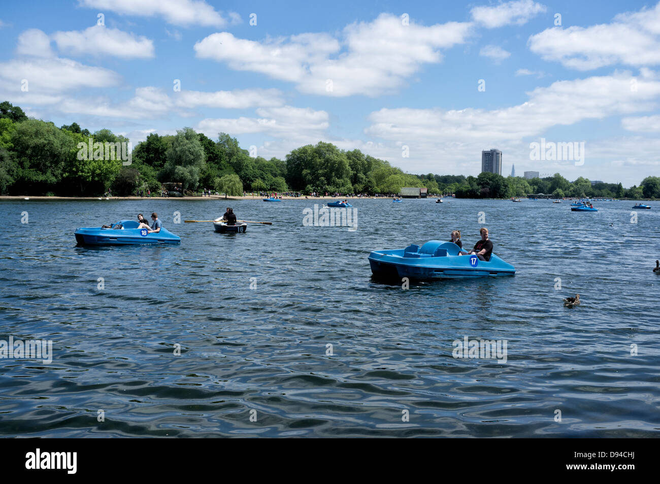 Families out boating on a lake in london. Picture by Julie Edwards ...
