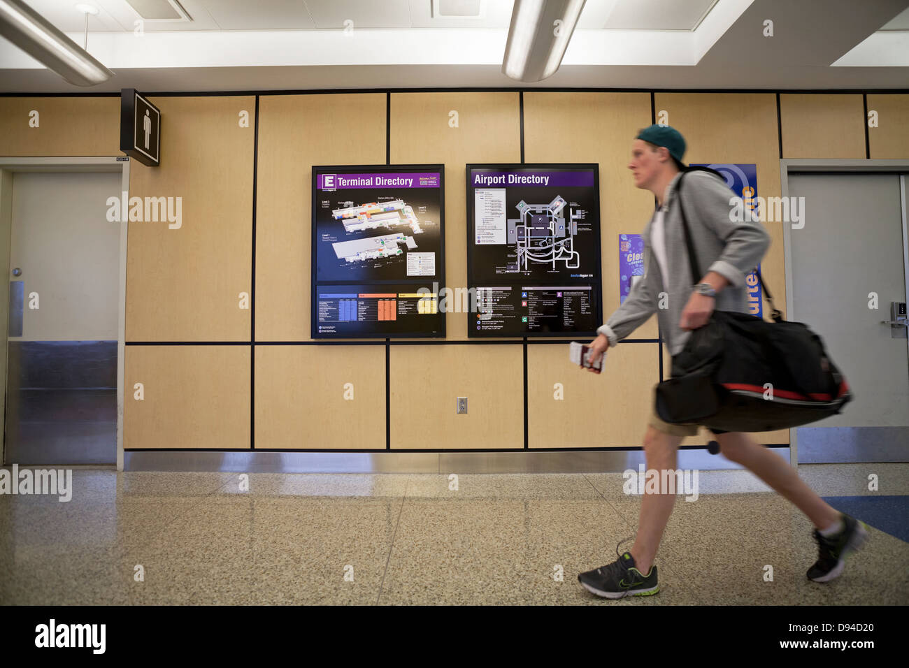 A passenger hurries to catch a flight at Boston's Logan airport Stock ...