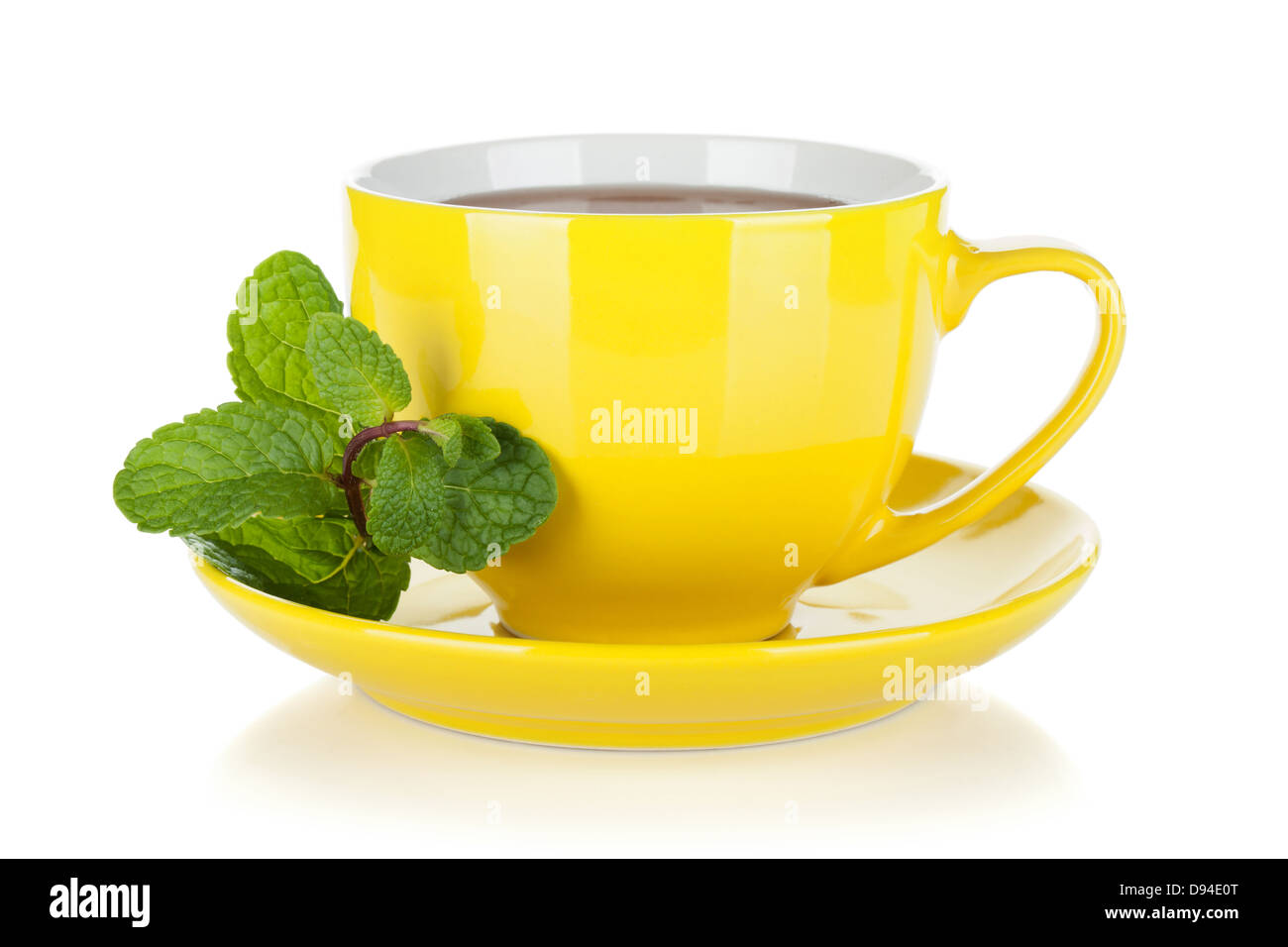 Yellow tea cup with mint. Isolated on white background Stock Photo - Alamy