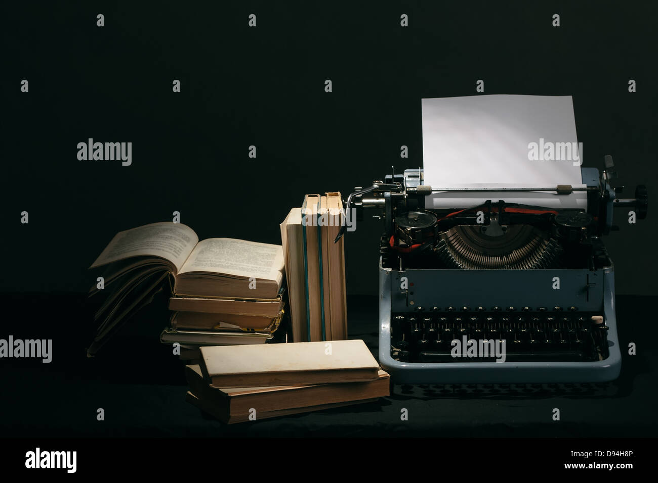 Old typewriter with paper and books, retro colors on the desk Stock ...