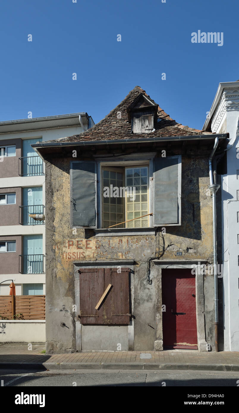 Old house in the middle of modern street Stock Photo - Alamy