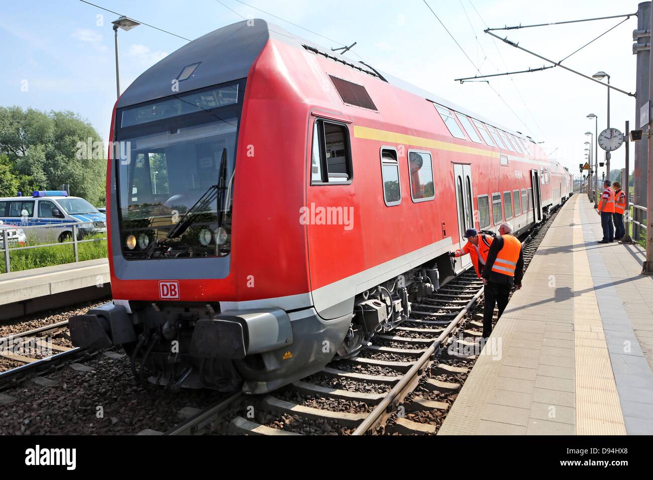 Staff of the Deutsche Bahn examine the damages of a derailed train in ...
