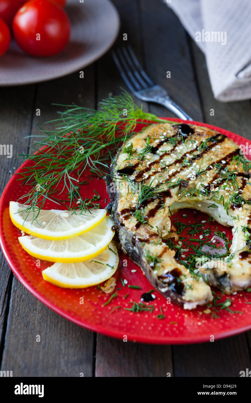 grilled fillet of fish escolar with lemon and sauce, food Stock Photo ...