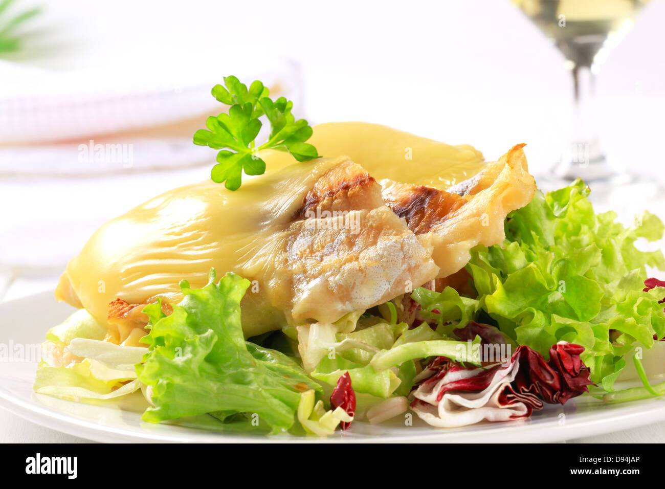 Cheese topped fish fillets Stock Photo - Alamy