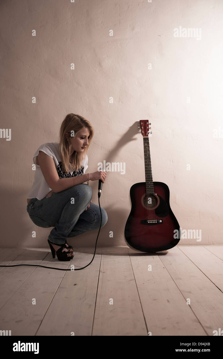 Woman lady female crouching hi-res stock photography and images - Alamy