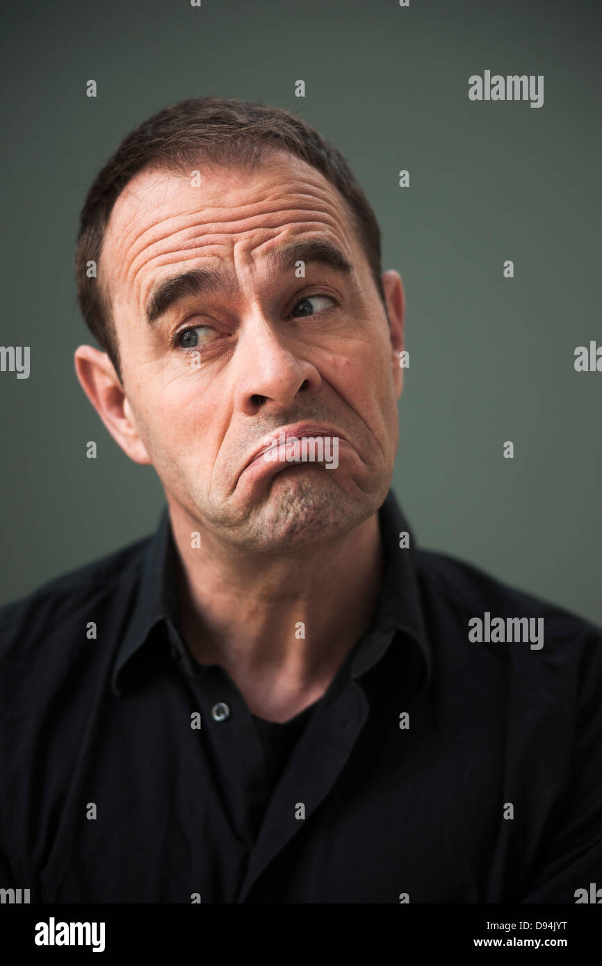 Head and Shoulders Portrait of Mature Man Frowning Stock Photo - Alamy