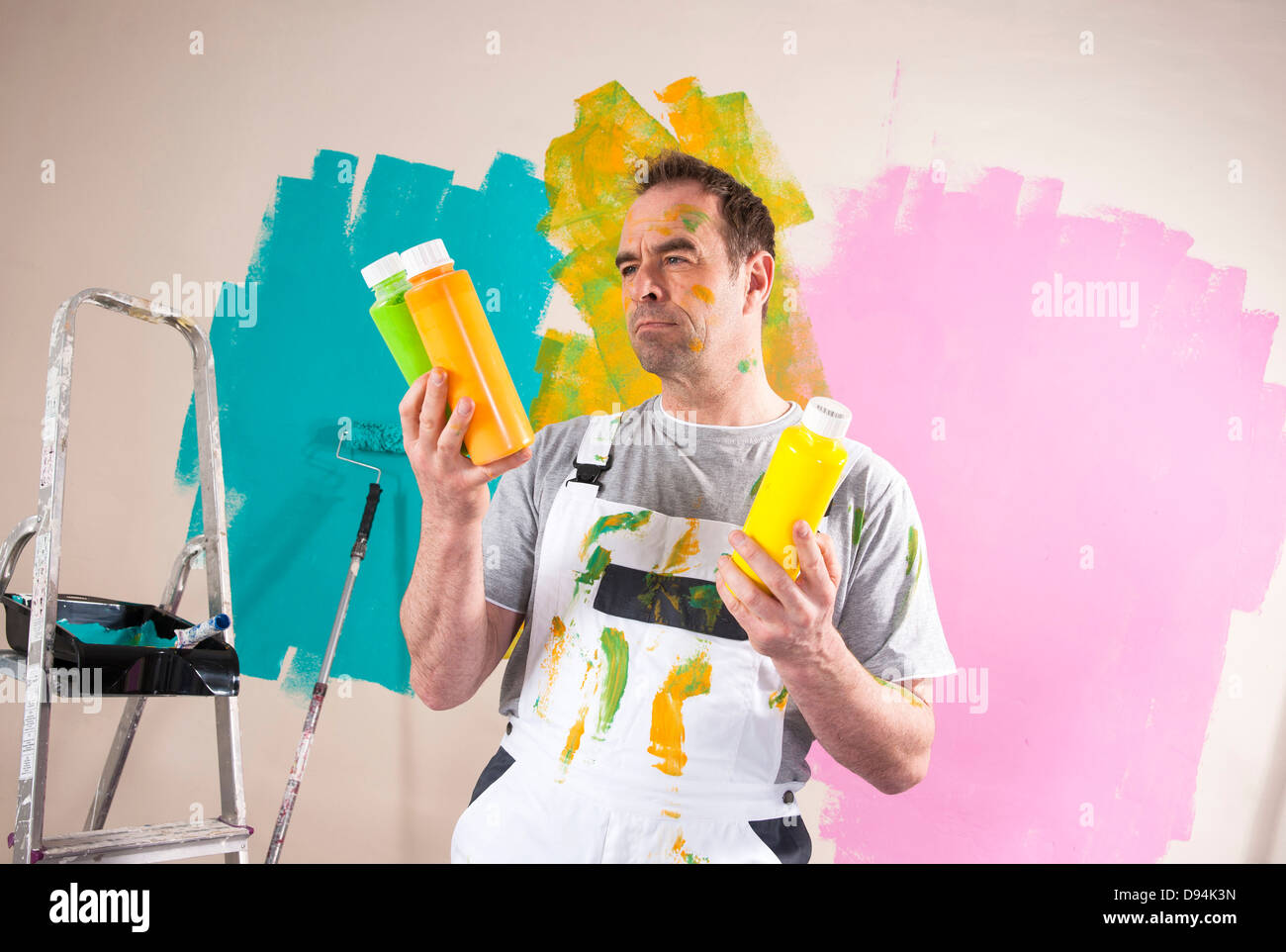 Mature Man Renovating his Home and Deciding between Paint Colors Stock ...