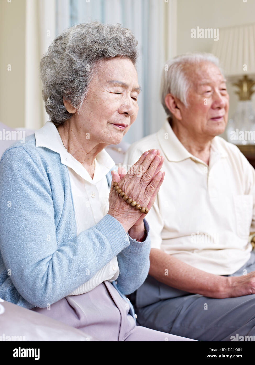 Old woman hands praying hi-res stock photography and images - Alamy