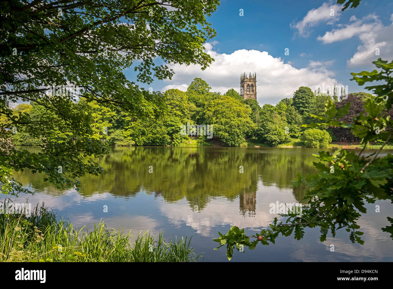 St. Mary's church seen across Lymm Dam at Lymm in Cheshire North West ...