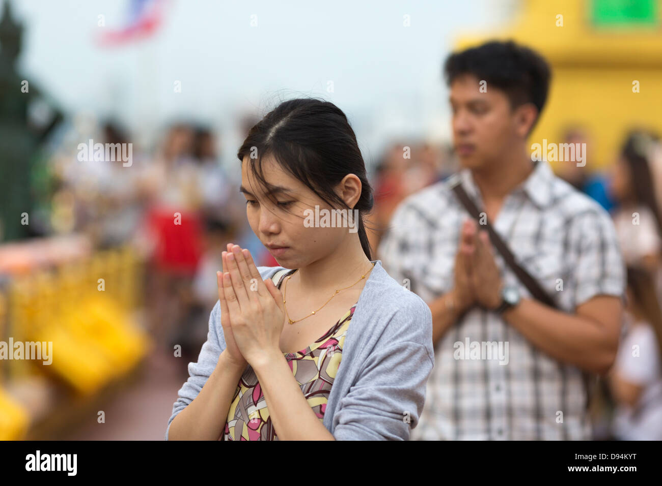 Thai Buddhists pray during a Buddha day around the stupa in the Golden ...