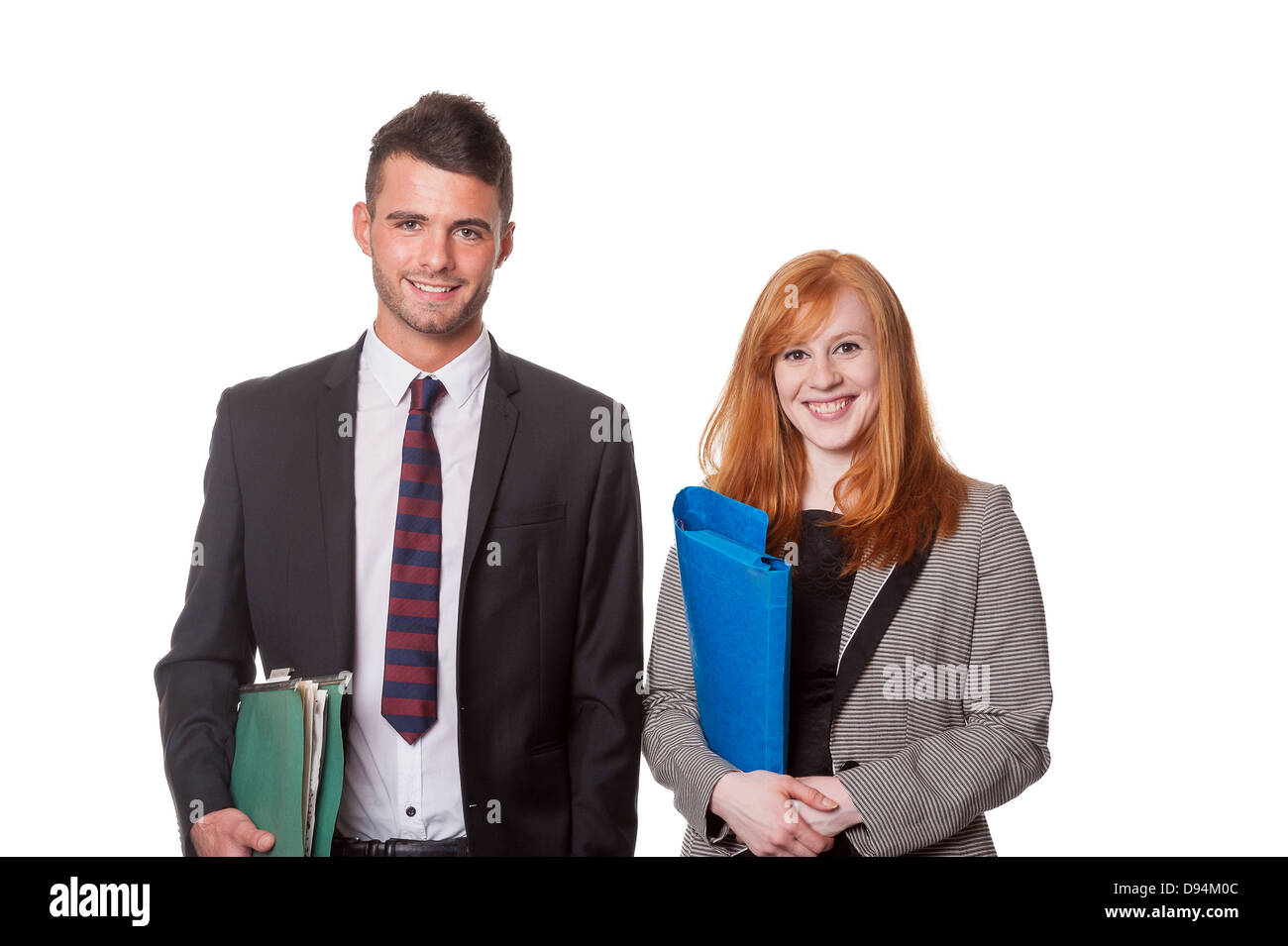 Confident friendly smiling business woman and man, standing holding ... Confident friendly smiling business woman and man, standing holding ...