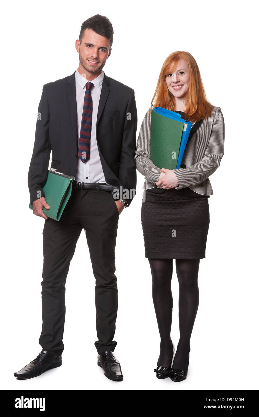 Confident friendly smiling business woman and man, standing holding ... Confident friendly smiling business woman and man, standing holding ...