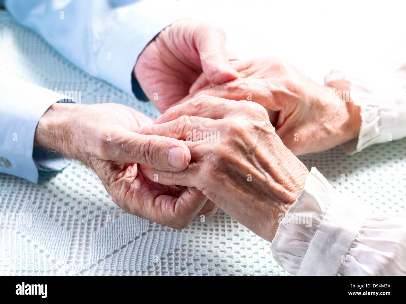 Old people holding hands. Closeup Stock Photo - Alamy