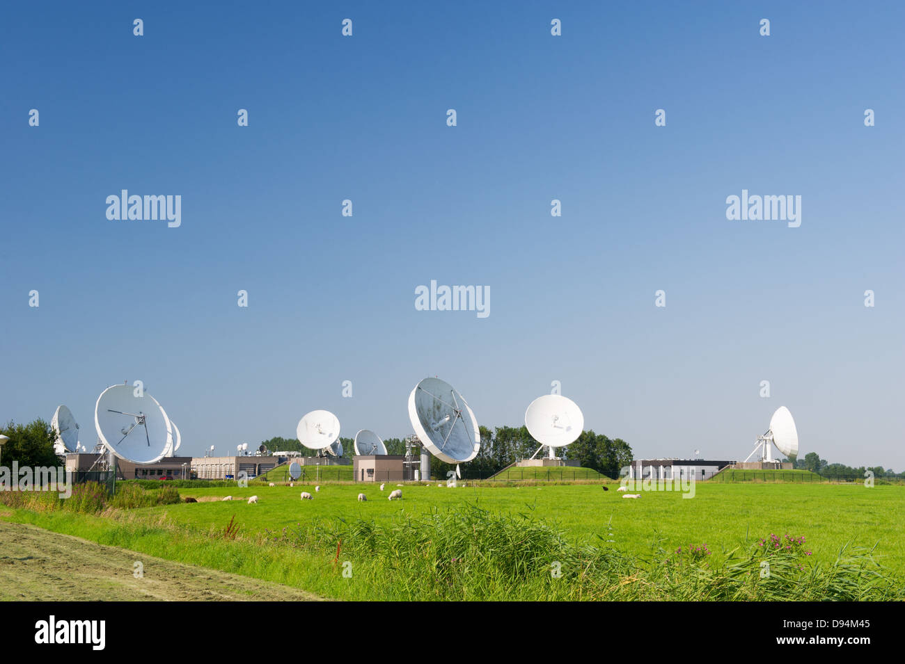 Many satellite dishes in landscape Stock Photo - Alamy