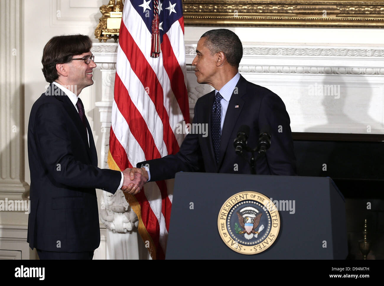 United States President Barack Obama (R) speaks as economist Jason ...