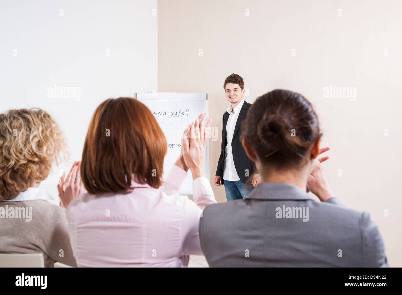 People Clapping for Man giving Business Presentation Stock Photo - Alamy