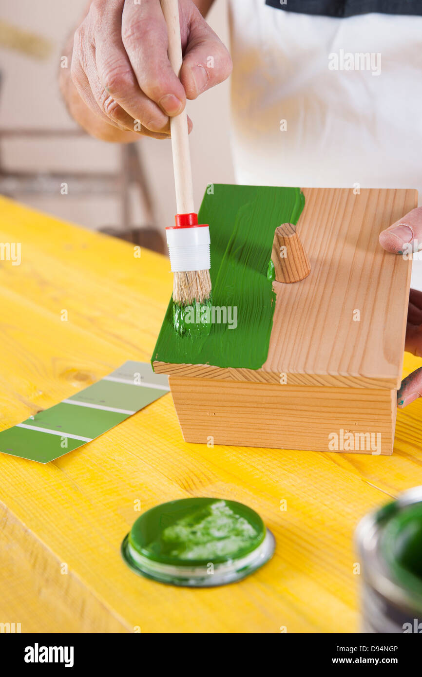 Man Painting Woodworking Project in Studio Stock Photo - Alamy