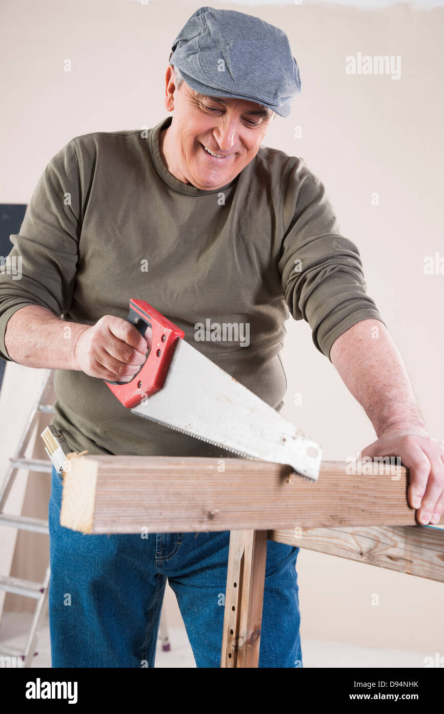 Man Cutting Lumber, Woodworking Project, in Studio Stock Photo - Alamy