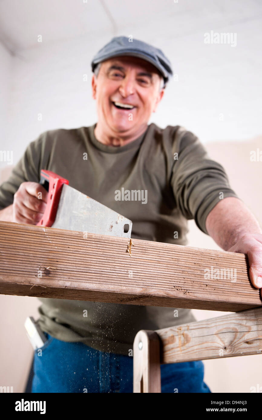 Man Cutting Lumber, Woodworking Project, in Studio Stock Photo - Alamy