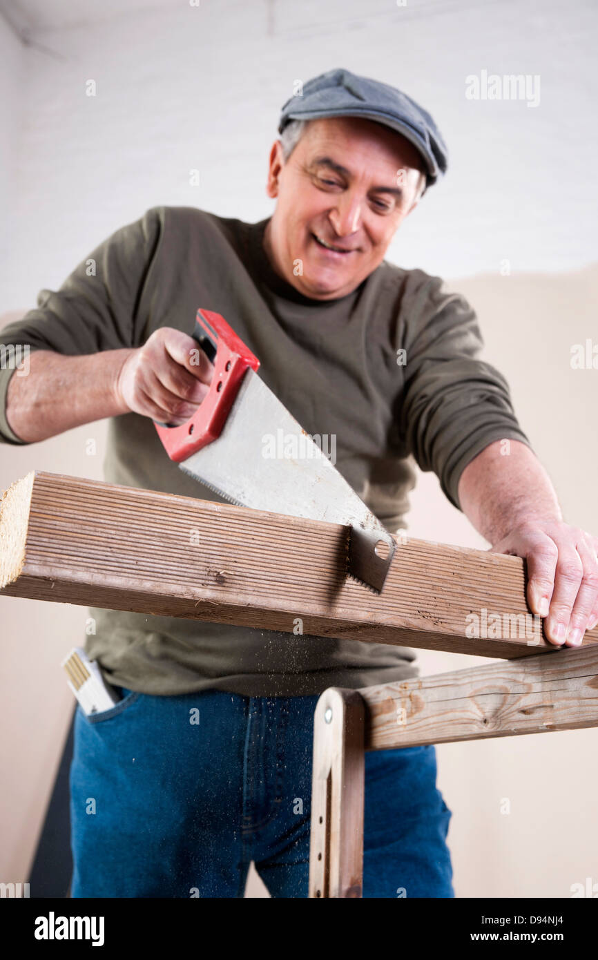 Man Cutting Lumber, Woodworking Project, in Studio Stock Photo - Alamy