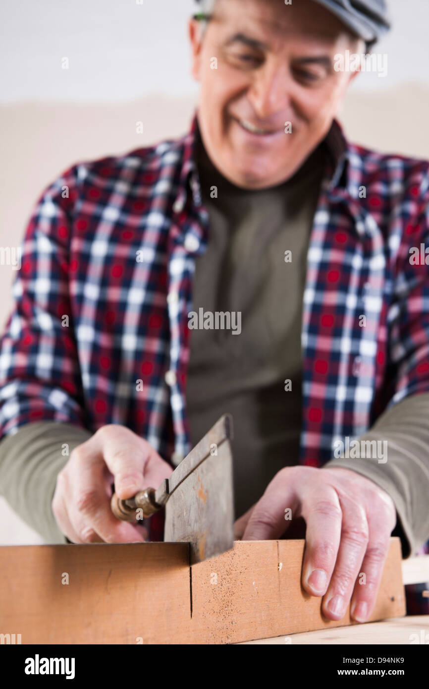 Man Cutting Lumber, Woodworking Project, in Studio Stock Photo - Alamy