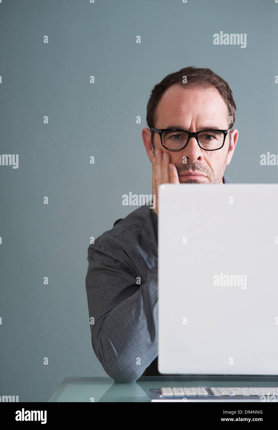 Man computer head in hands screen hi-res stock photography and images ...