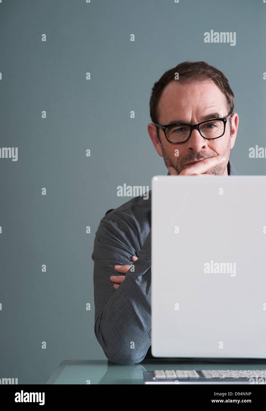 Buisnessman Using Computer in Studio Stock Photo - Alamy