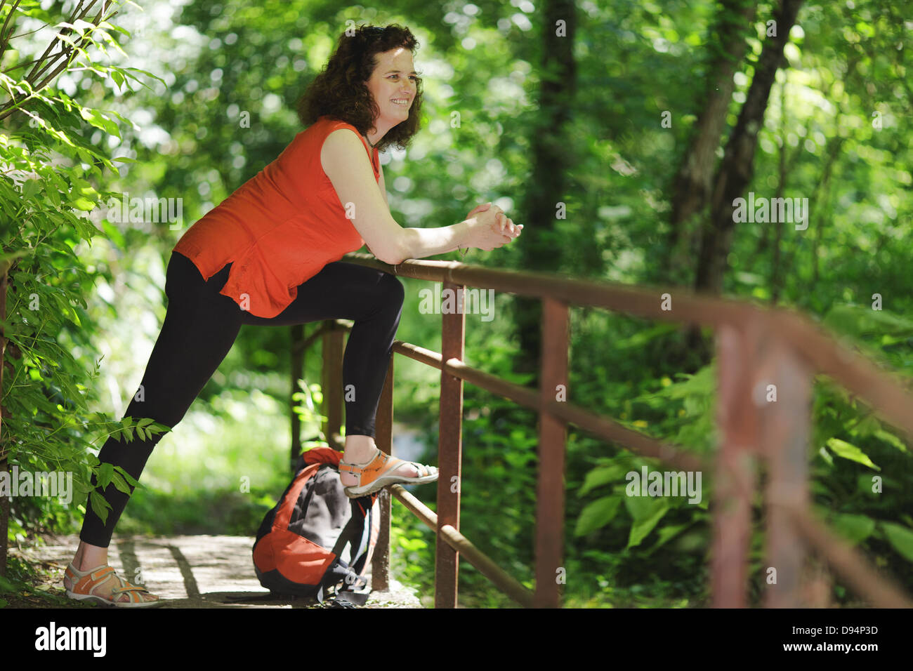 Person standing on a bridge hi-res stock photography and images - Alamy