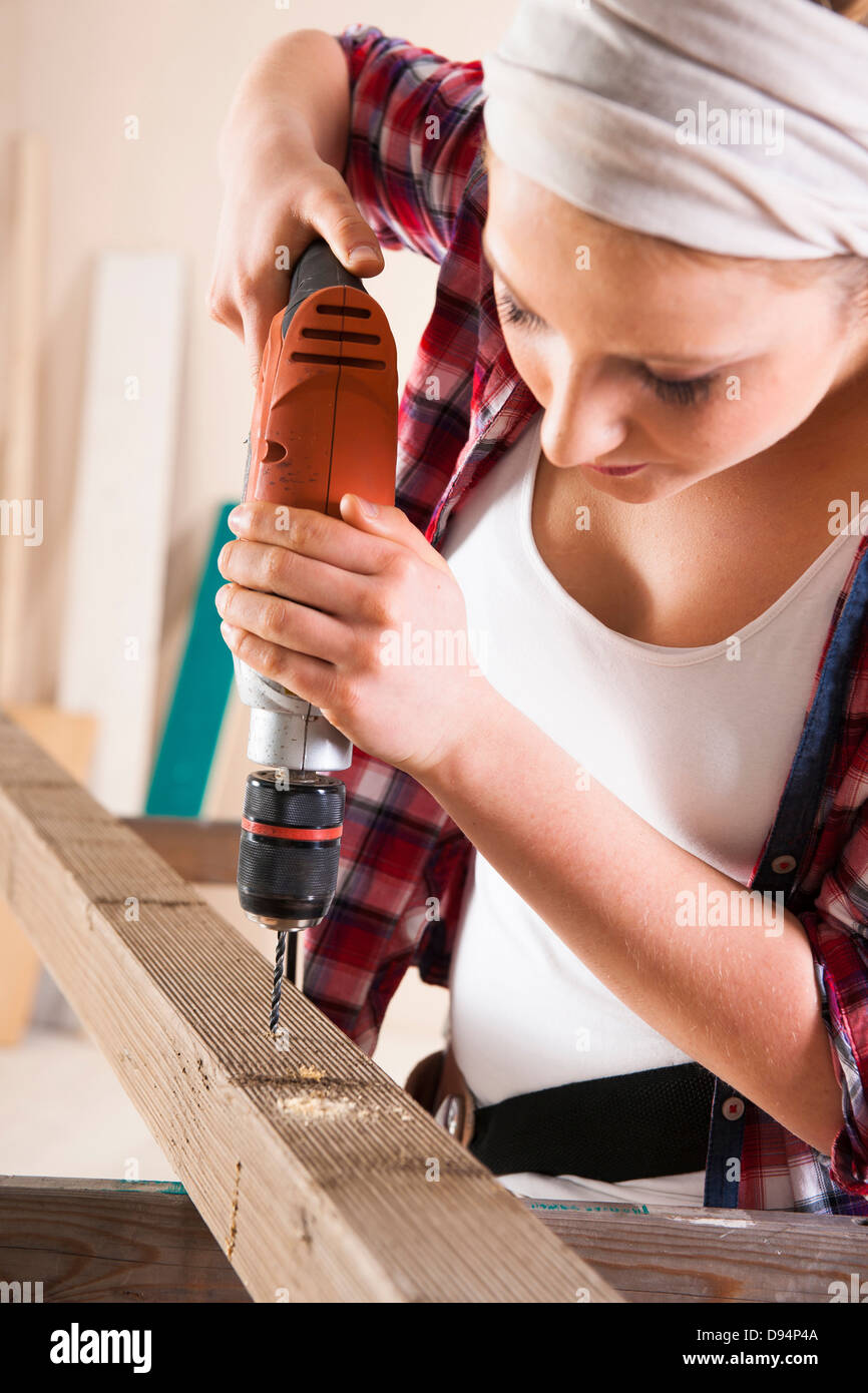 Female handyman drill hi-res stock photography and images - Alamy