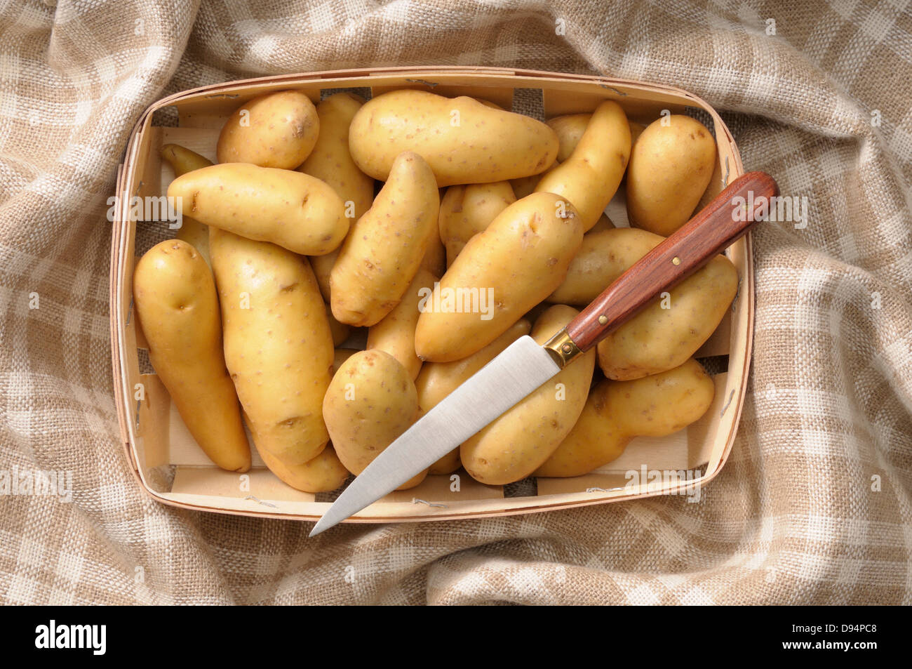 Overhead View of Potatoes in Basket with Knife Stock Photo - Alamy