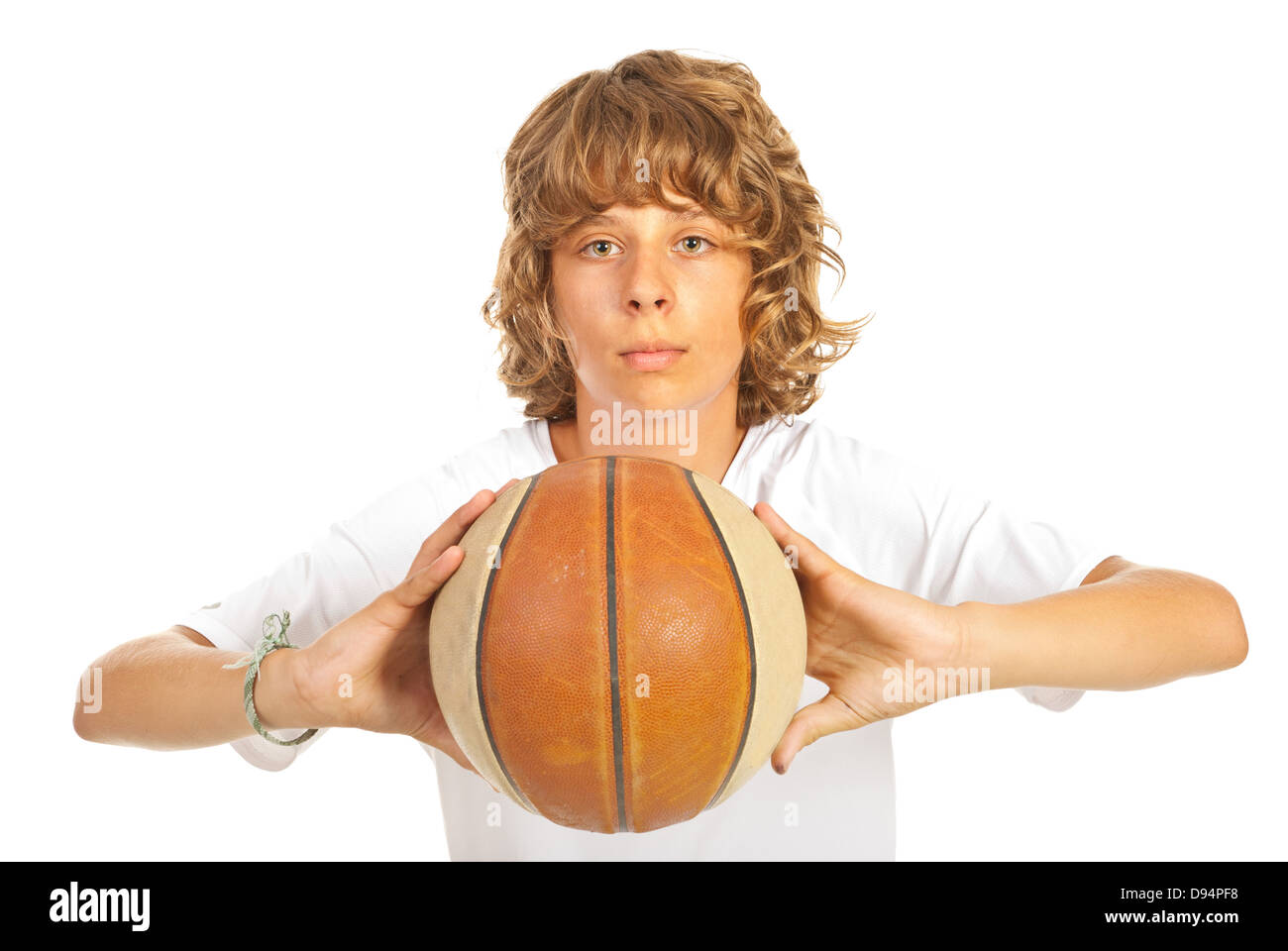 Blond adolescent boy ready to throw basketball isolated on white ...