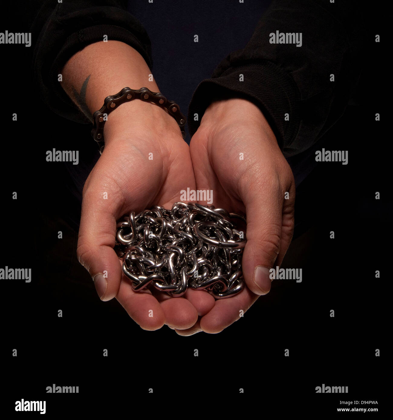 Close-up of Woman's Hands holding Chain, Studio shot Stock Photo - Alamy