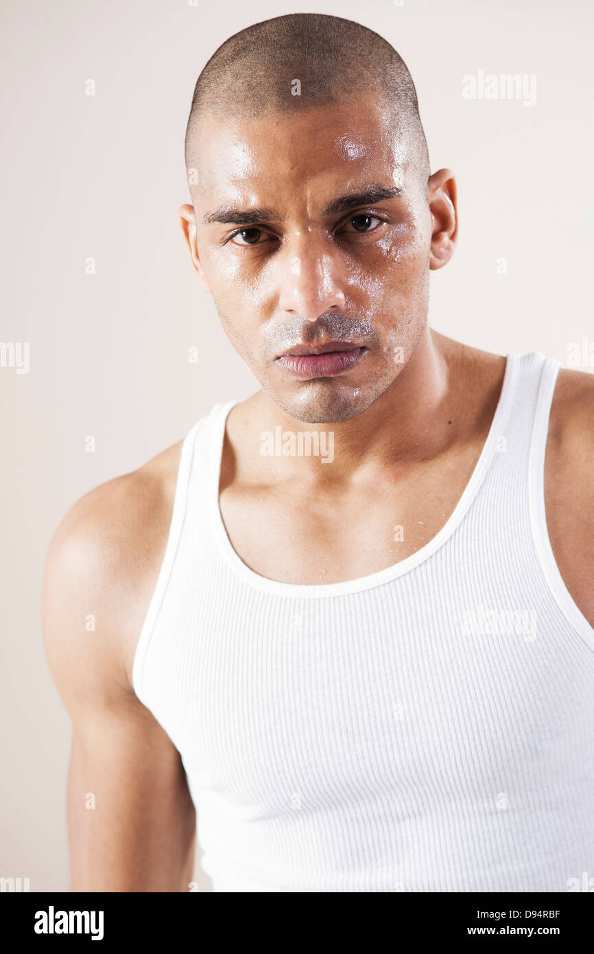 Man Wearing Work Out Clothes and Sweating in Studio with White ...