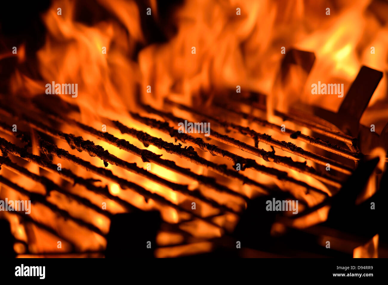 Close up image of a BBQ grill with flames Stock Photo - Alamy