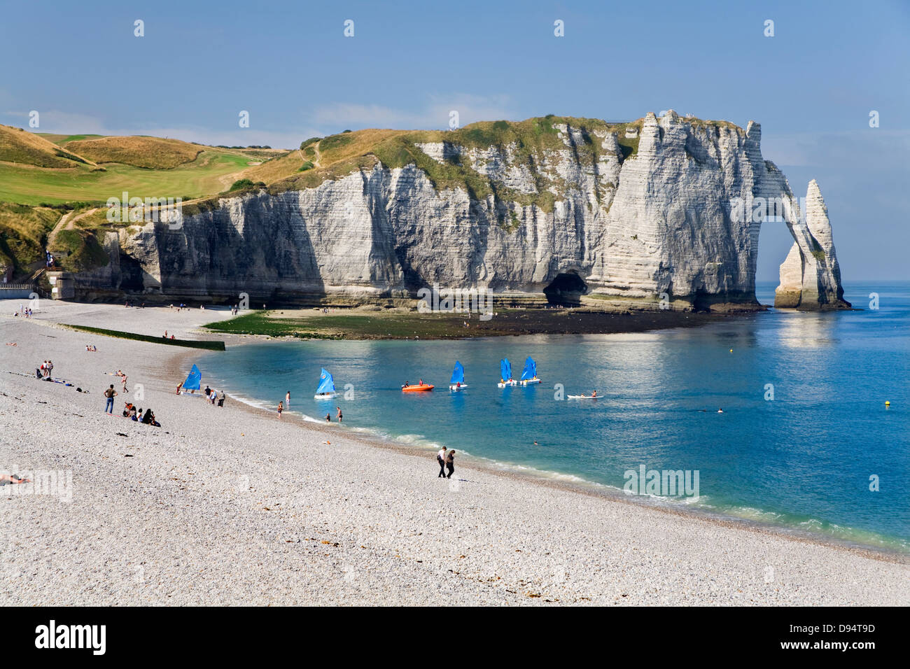 Cliffs, natural arch and stone beach Stock Photo - Alamy