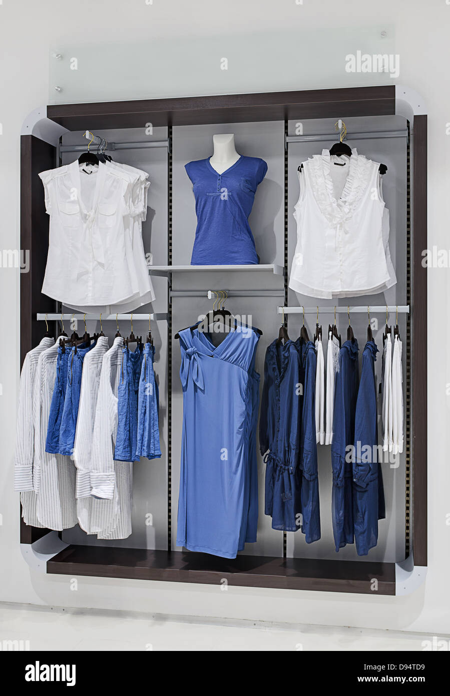 Clothing on display at shopping mall Stock Photo - Alamy