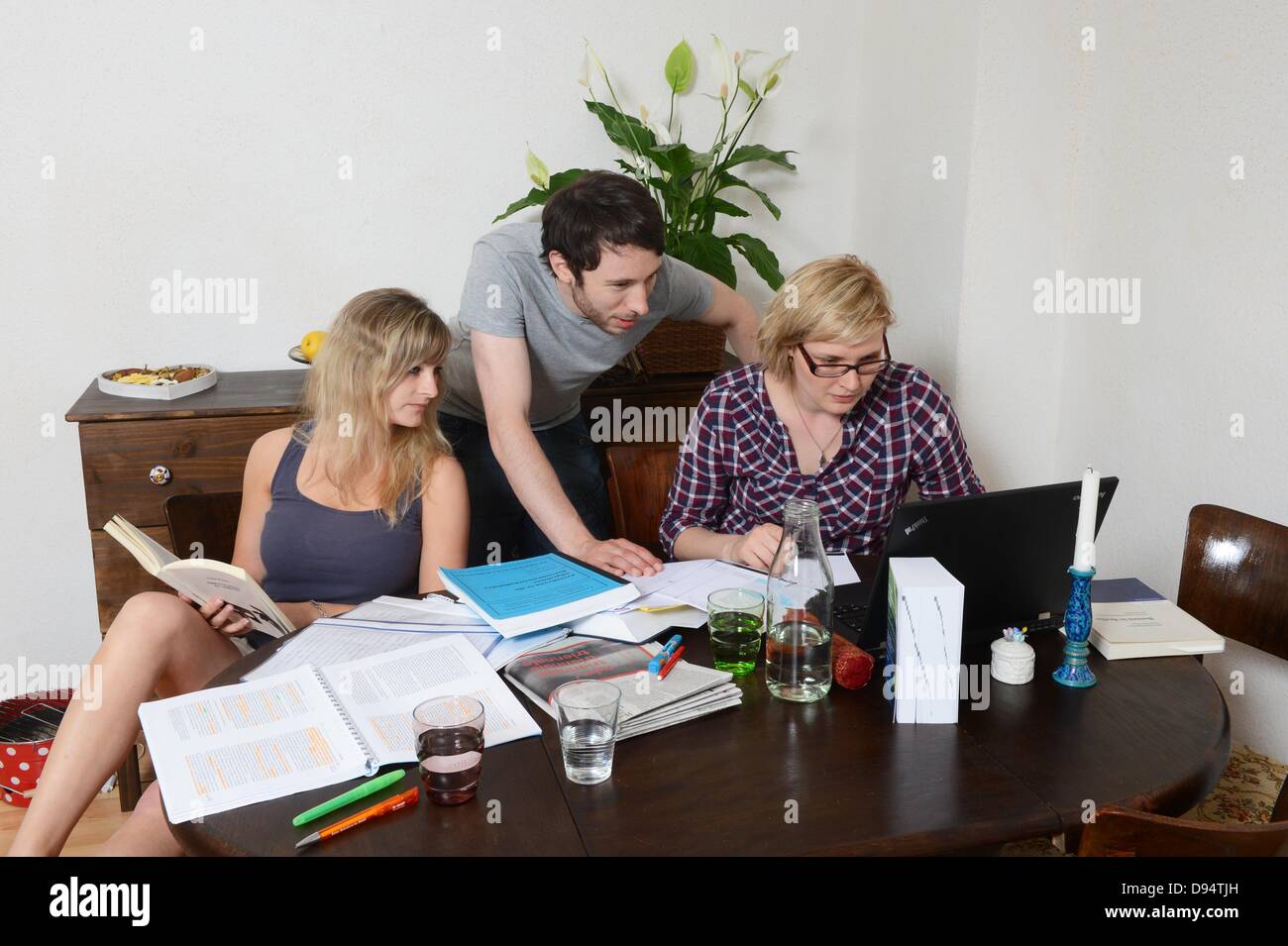 Illustration - Students study together at the table in their shared ...